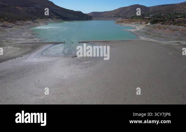 Drone 4k aerial footage of reservoir with low levels of water land deep ...