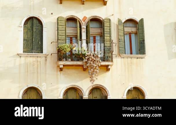 Close-up of various windows with Venetian blinds and shutters in the ...