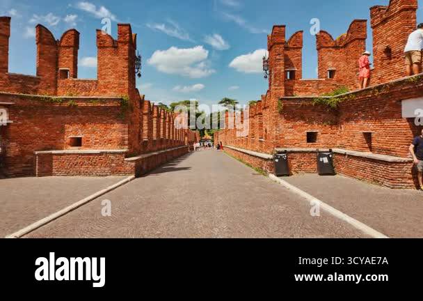 VERONA, Italy, 12 JULY 2024 - Fortified brick towers linked by elegant ...