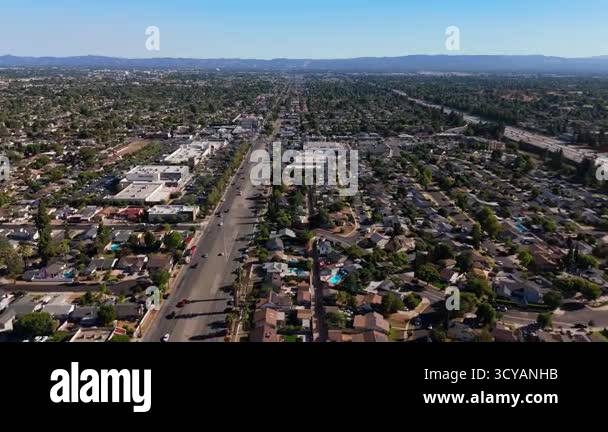 Drone aerial view of suburban neighborhoods, streets, and commercial ...