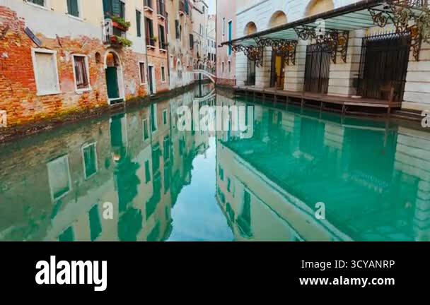 Stunning view of one of the famous canals in Venice, Italy along with quirky buildings, powerful ...