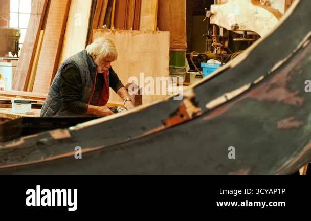 VENICE, Italy, 9 NOVEMBER 2024 - A seasoned gondola carpenter, or ...