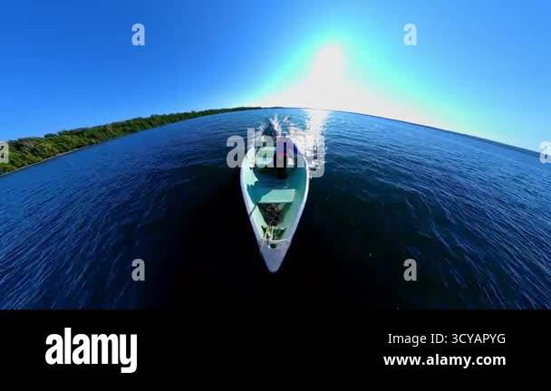 Fishing boat gliding at inland lake of Manitoulin Island. Water sport ...