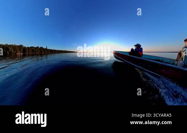 Fishing boat gliding at inland lake of Manitoulin Island. Water sport ...