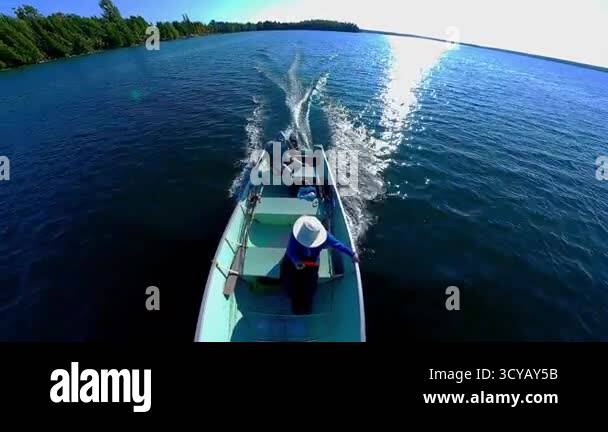 Fishing boat gliding at inland lake of Manitoulin Island. Water sport ...