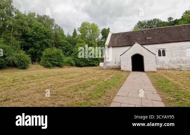 White stone building surrounded by lush greenery Stock Video Footage ...