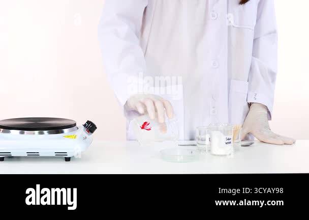 Demonstrating sodium acetate crystallization in a lab setting Stock ...