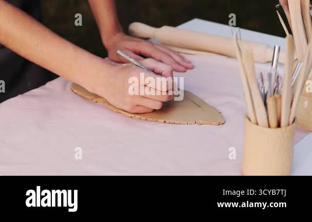 Pottery Cutting Clay Close-up 4k video. Cutting clay precise patterns ...