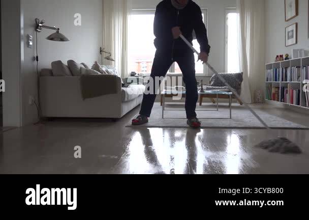 Man mop wet floor Stock Videos & Footage - HD and 4K Video Clips - Alamy