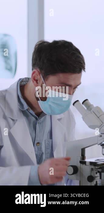 Attractive young doctor scientist in microbiology center smiling to ...