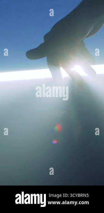 A captivating image shows a hand reaching out, illuminated by radiant ...