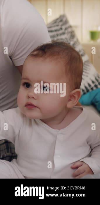 A delightful and adorable baby is happily exploring and discovering new ...