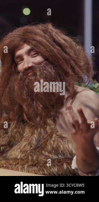 Portrait of Funny Bearded Caveman in Animal Fur Pointing to Camera ...