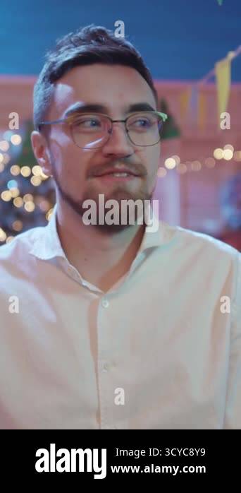 A joyful man with a beard is smiling with his eyes closed, basking in a ...