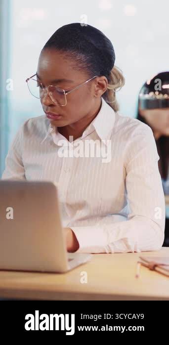 African Young Woman Working in Corporate Business Cneter Using Laptop ...
