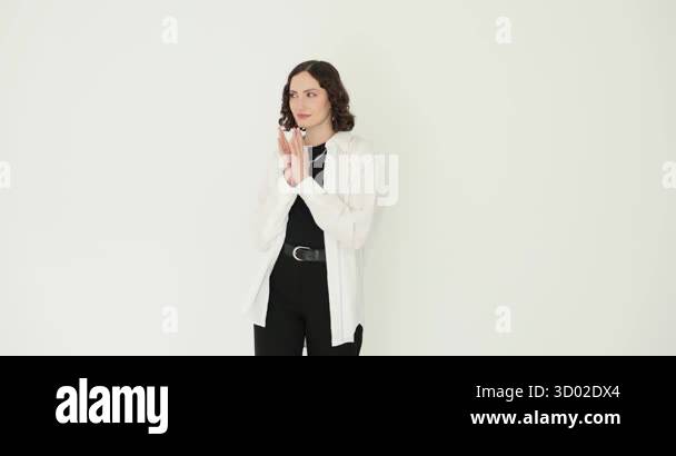 Stylish woman shows impatience by tapping fingers rhythmically against ...
