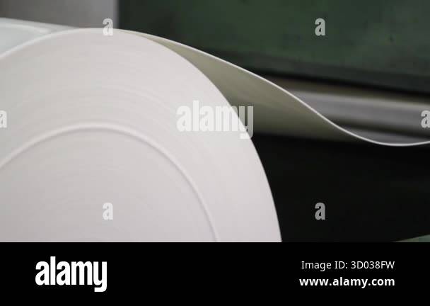 Substantial plastic reel on an advanced industrial machine in a factory ...