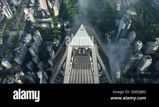An extreme overhead aerial view shows the modern, pyramid shaped roof ...