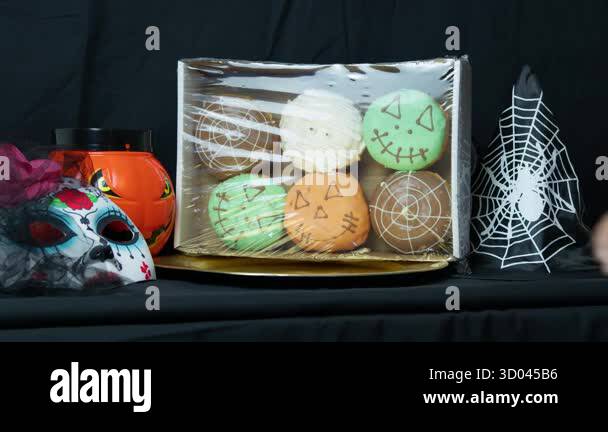 Hand taking death mask from the Halloween display. High quality 4k ...