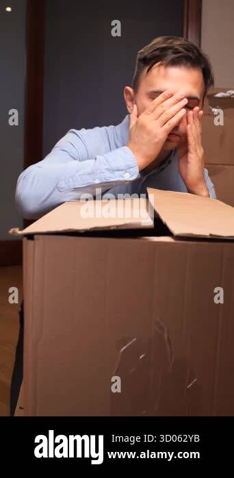 vertical video Young man receiving a strong headache and feeling ...