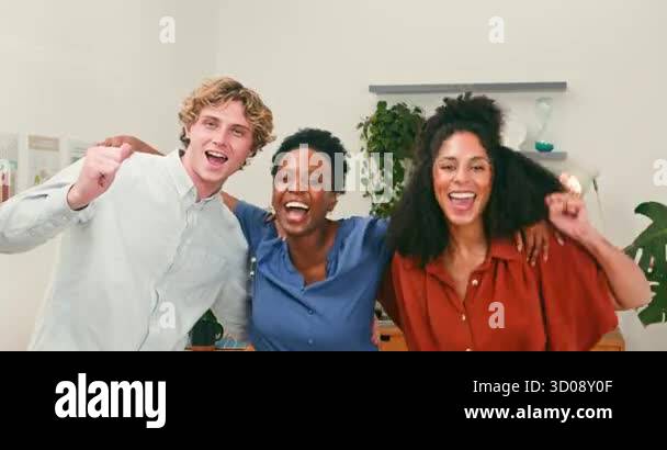 A vibrant and diverse team of colleagues bursts with joy and laughter ...