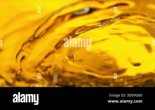 Super Slow Motion Shot of Rippling Golden Liquid Background at 1000fps ...