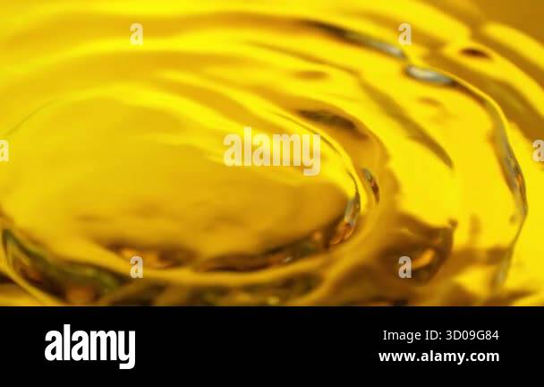 Super Slow Motion Shot of Rippling Golden Liquid Background at 1000fps ...