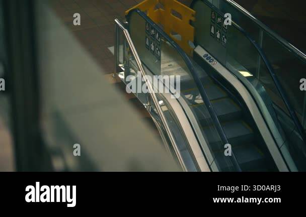 Escalator moving staircase in shopping mall wide top view 4k shot selective focus Stock Video ...