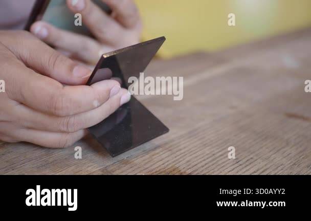 Hand using smart phone to scan the QR code to find the cafe menu Stock ...