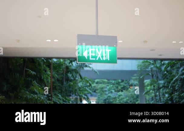 Exit sign indicates way leave Stock Videos & Footage - HD and 4K Video ...