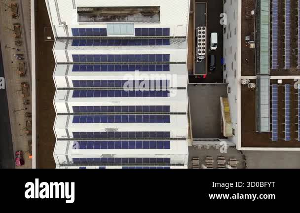 Top-down view of modern buildings with solar panels revealing courtyard ...