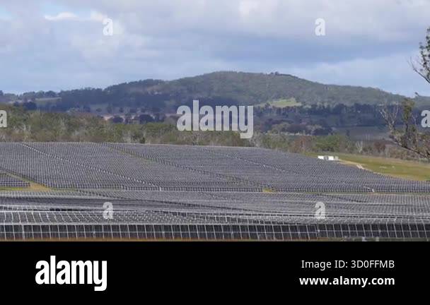 Solar panels arrayed across a large field Stock Video Footage - Alamy