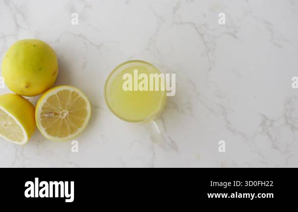 Simple steps to prepare refreshing lemon juice using fresh lemons Stock ...