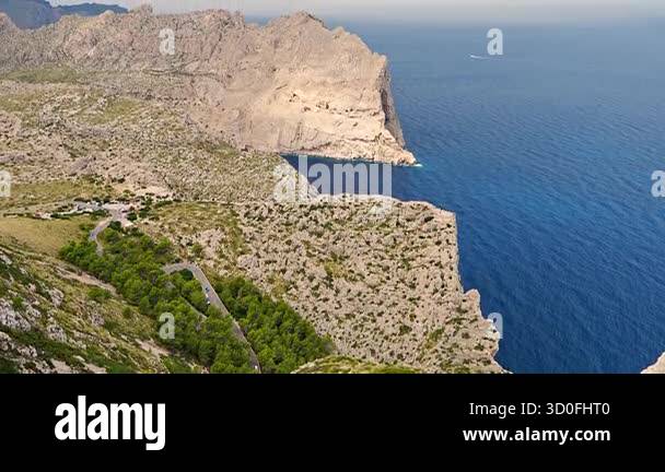 Curvy mountain road leading to the iconic Formentor lighthouse on ...
