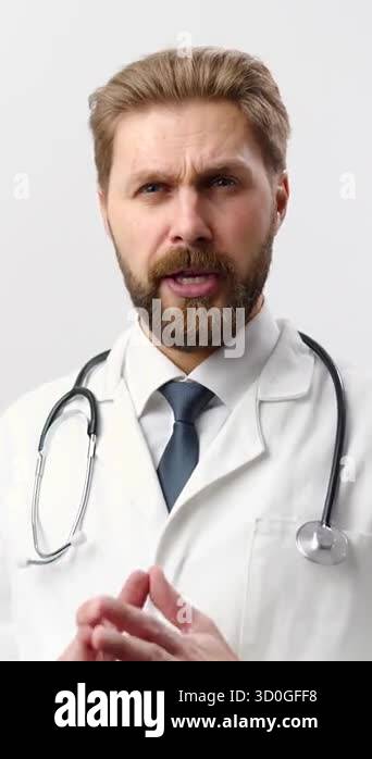 A doctor engages in a video chat consultation, providing health advice ...