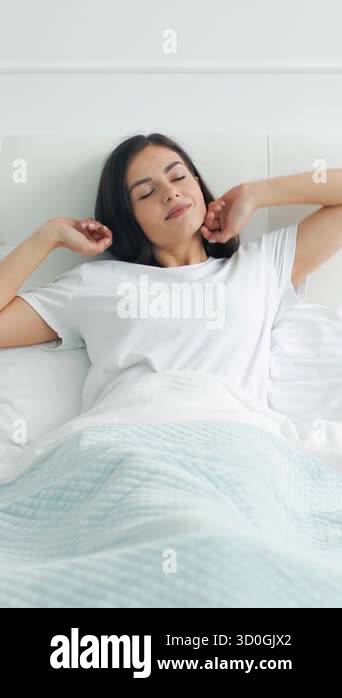 Feel the refreshing start of a new day as a person awakens, stretching ...
