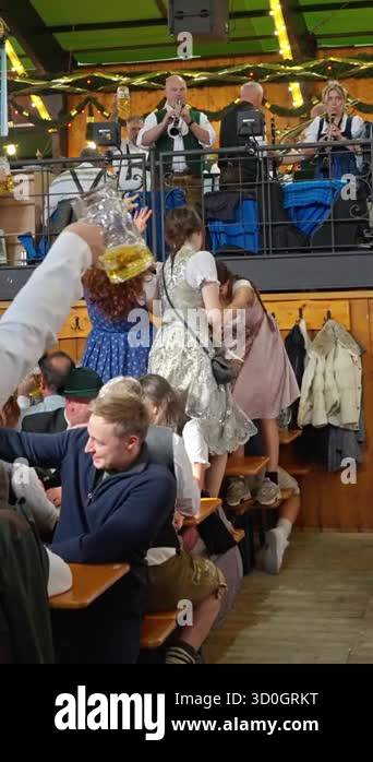 Octoberfest. Munich Germany 03. 10. 2025. A lively indoor scene of ...