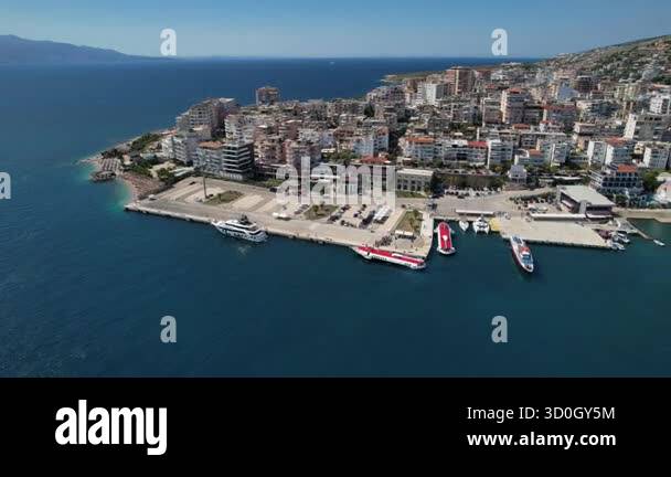 Wide drone view of Saranda port and bay with ferries at the pier ...
