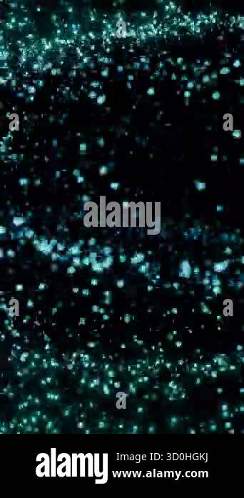 Pink and yellow grains of sand creating a moving abstract background ...