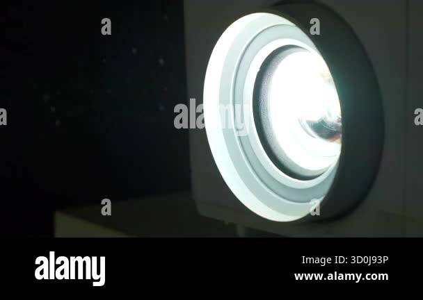 Cinema hall. Movie is shown through projector. Light of different ...