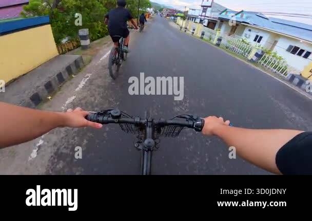 First-Person View of Cycling on City Road Stock Video Footage - Alamy