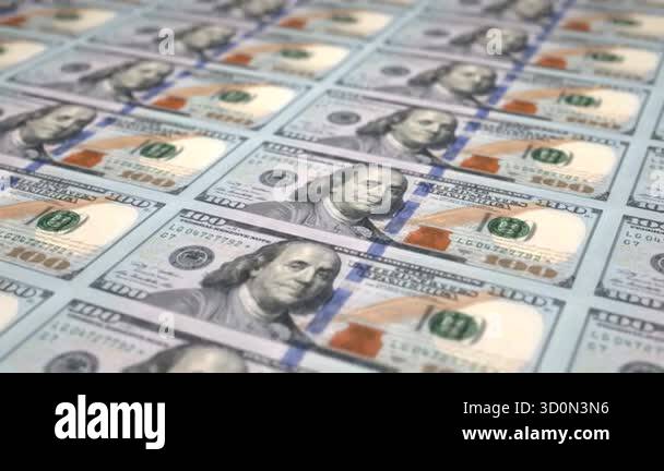 Rows of new banknotes moving through a factory, showing the designs and ...