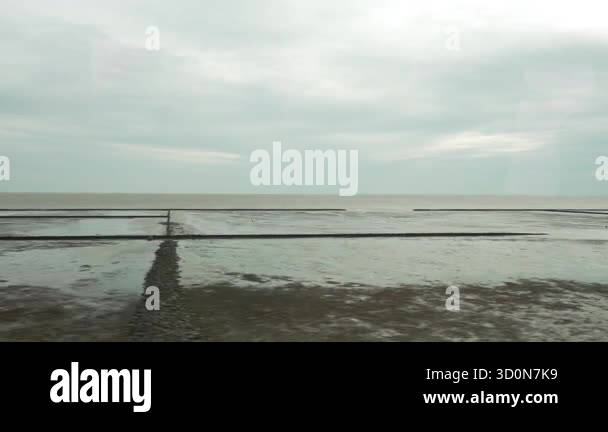The camera shows the vast mudflats of the North Sea during low tide ...