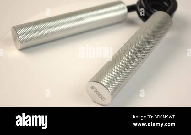 Hand grippers on rotating background Stock Video Footage - Alamy