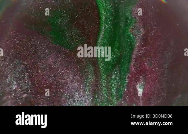 Rainbow ink splash. Glitter fluid. Defocused red green colorful paint ...