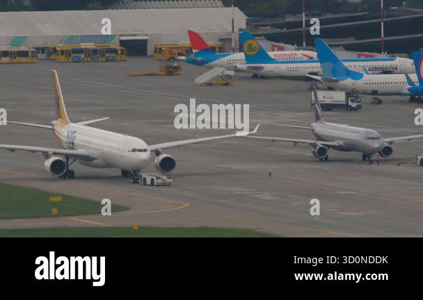 SOCHI, RUSSIA - AUGUST 02, 2022: Tractor pulling Airbus A330, RA-73684 ...