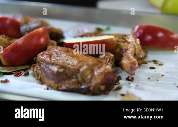 Step by step cooking of duck legs with apples. Young woman slices ...