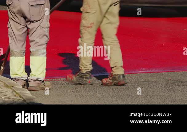 Process of painting for speed restricting road surface marking with red ...