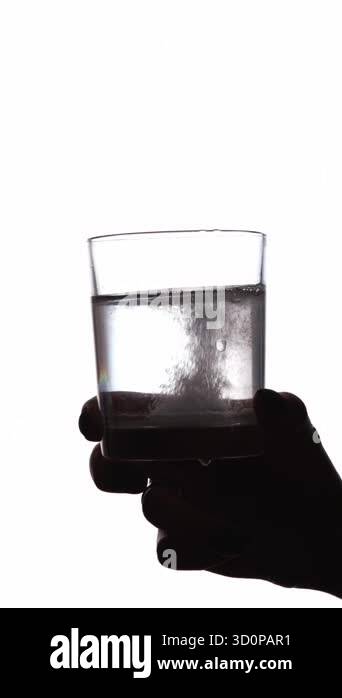Vertical video. Effervescent medicine. Fizzy drug. Dark contrast ...