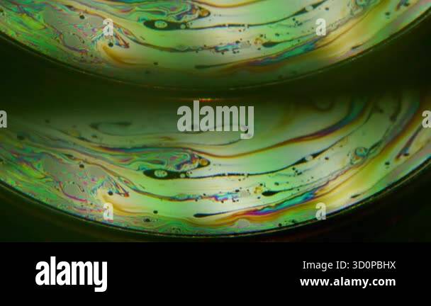 Fuel ink blur. Colorful flare. Gasoline paint floating on dark black ...